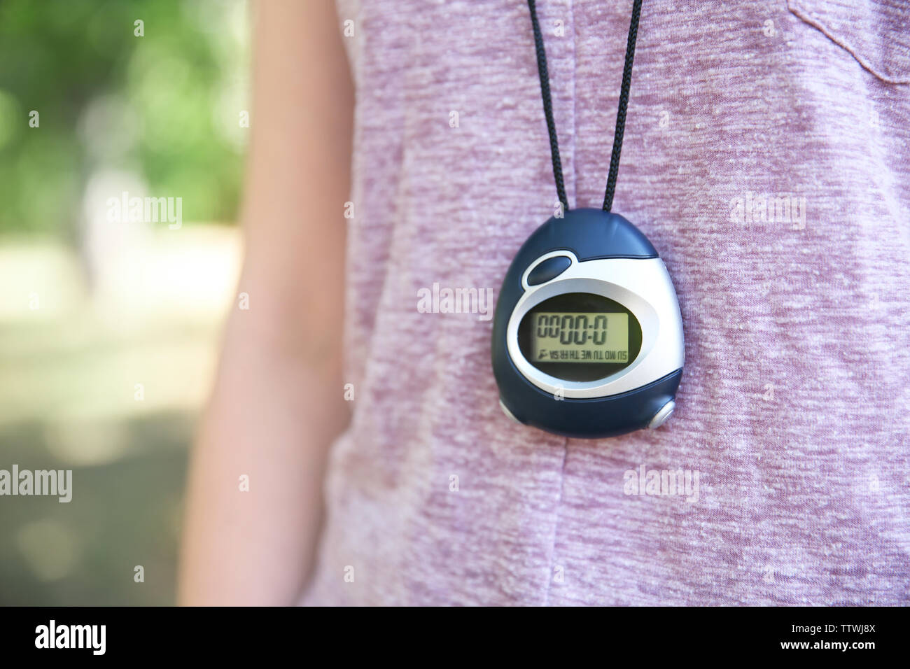 Digital stopwatch hanging on female neck Stock Photo - Alamy