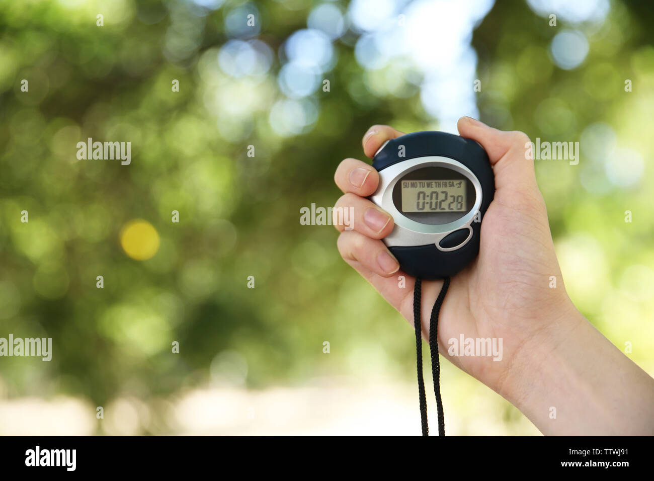 Female hand holding digital stopwatch, close up Stock Photo - Alamy