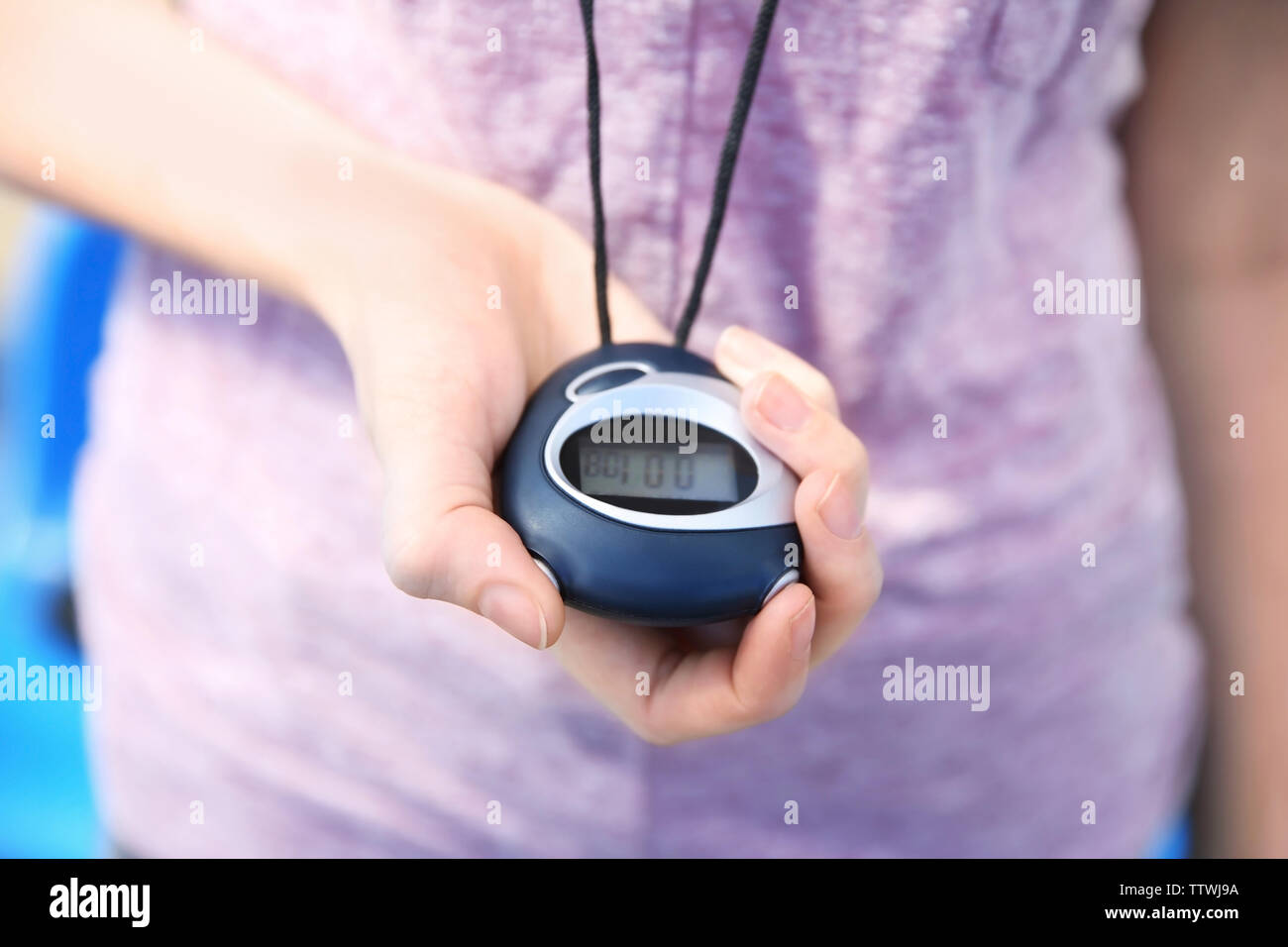 Female hand holding digital stopwatch, close up Stock Photo - Alamy