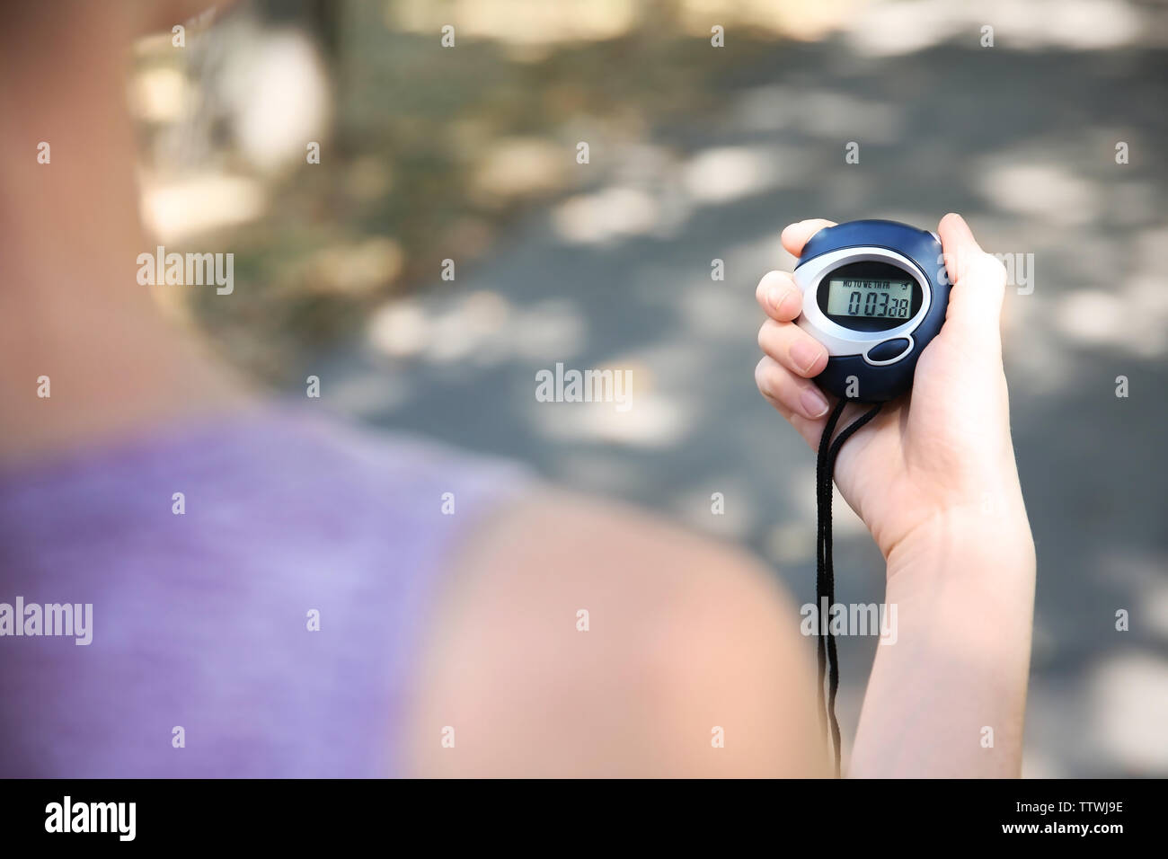 Female hand holding digital stopwatch, close up Stock Photo - Alamy