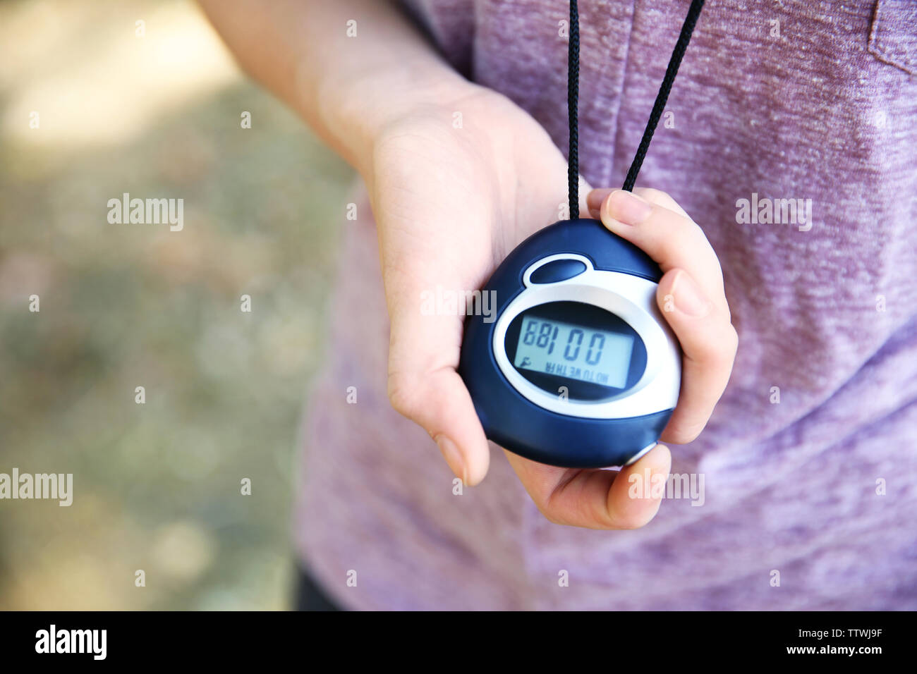 Female hand holding digital stopwatch, close up Stock Photo - Alamy