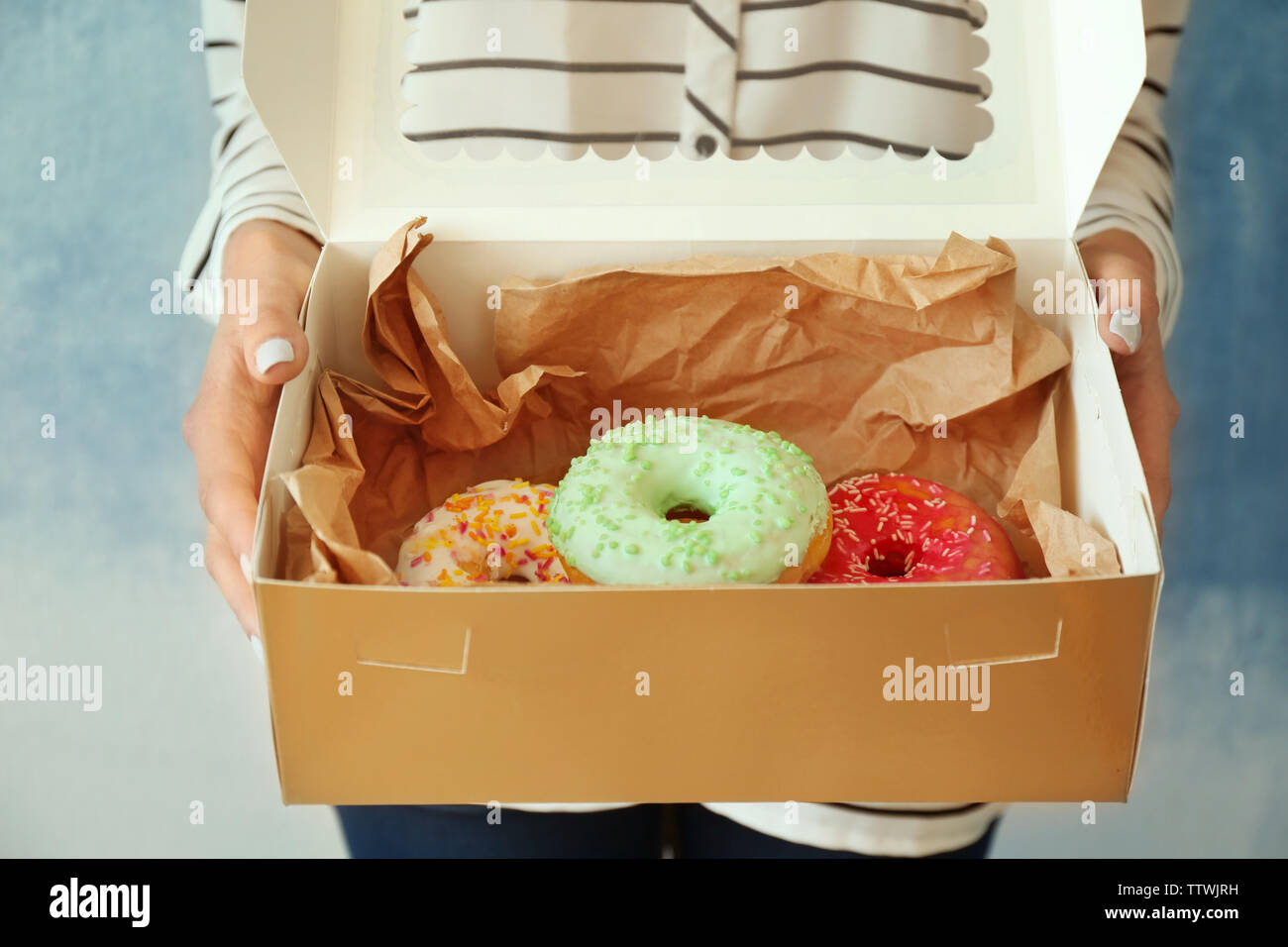 Holding box donuts hi-res stock photography and images - Alamy