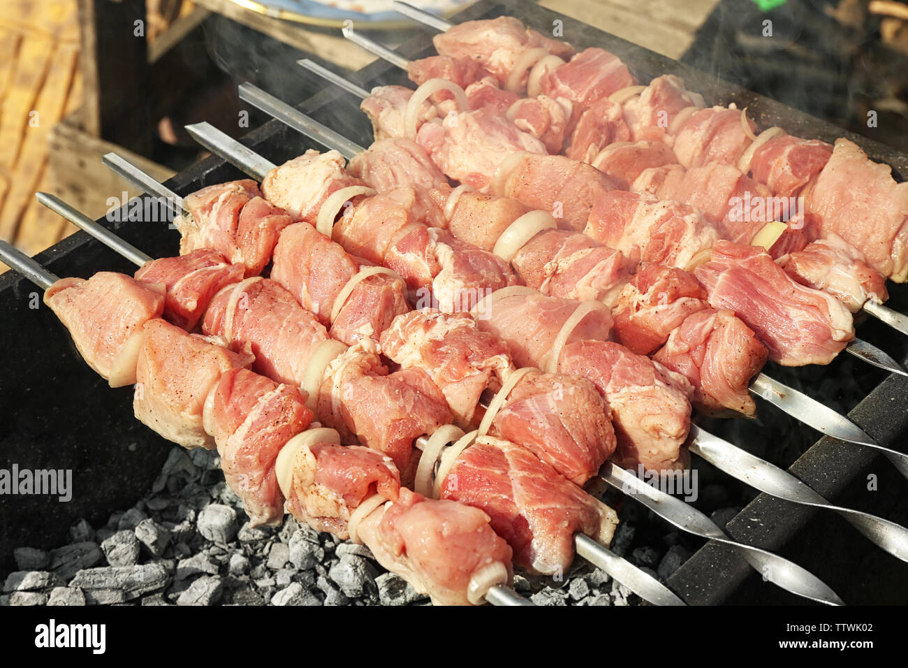 Raw barbecue in brazier outdoors Stock Photo - Alamy
