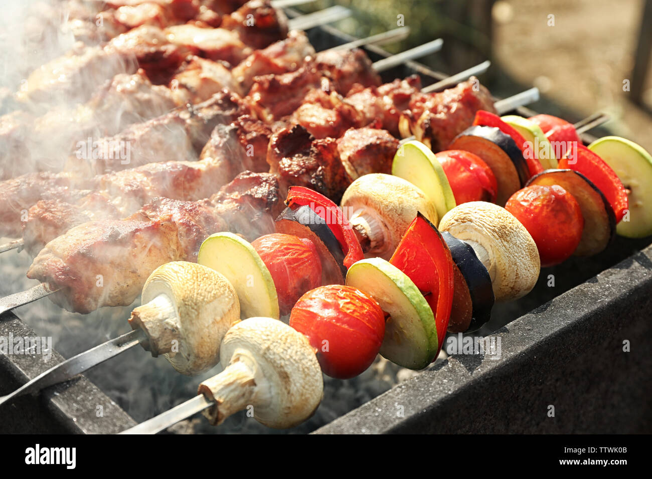 Fresh tasty barbecue with vegetables in brazier outdoors Stock Photo ...