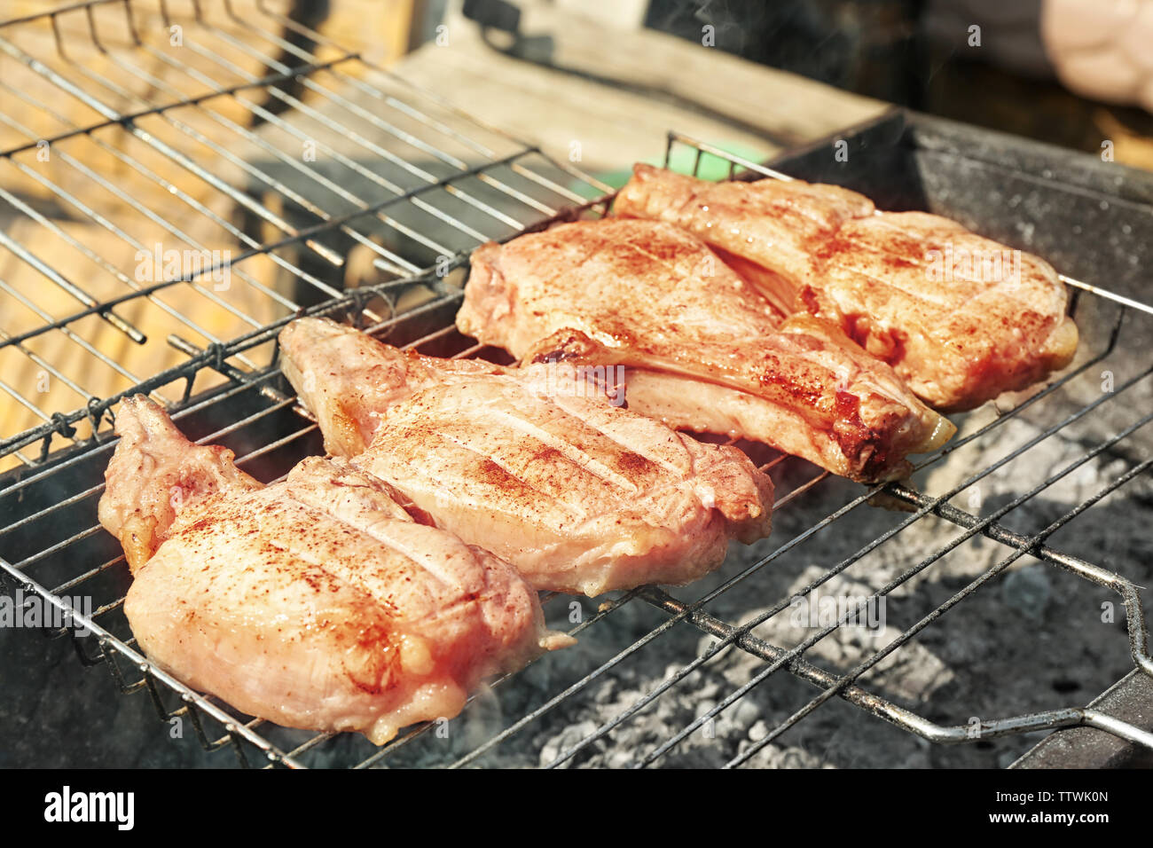 Fresh meat on grill outdoors Stock Photo - Alamy