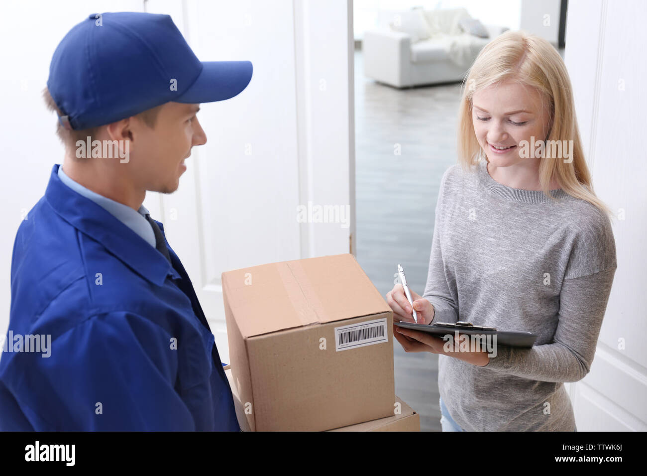 Signing for package hi-res stock photography and images - Alamy