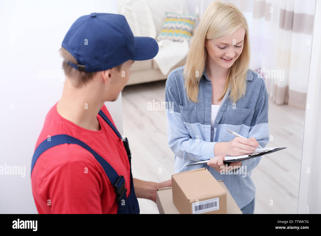 Signing for package hi-res stock photography and images - Alamy