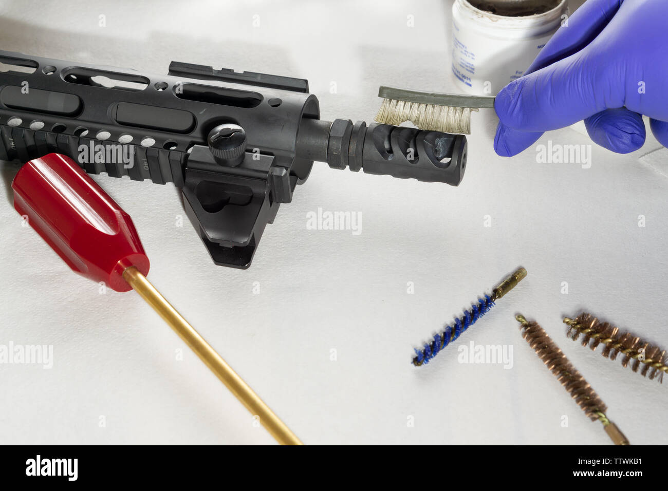 Rifle and Bore brush, coated rods on white backgrounde. Cleaning gun ...