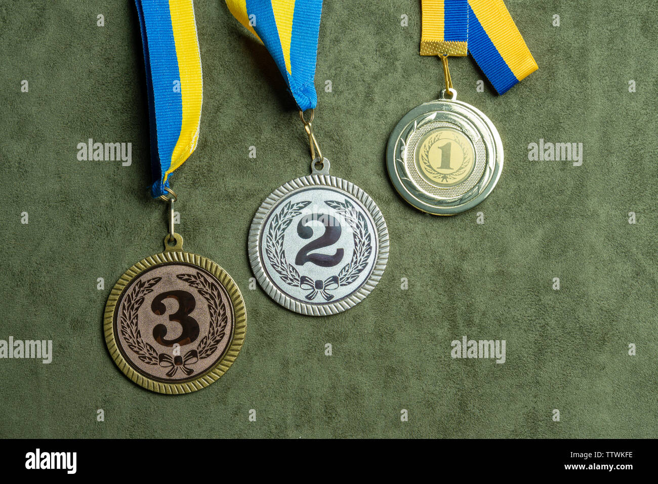 Gold, silver or bronze medal with yellow and blue ribbons Stock Photo ...
