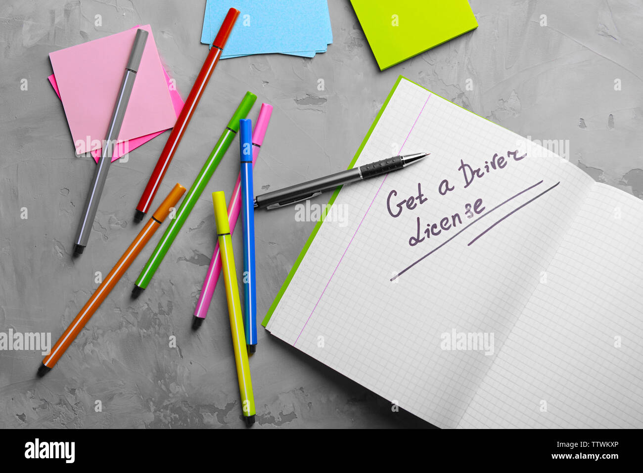 Notepad with text and stationery. Driver license concept Stock Photo ...