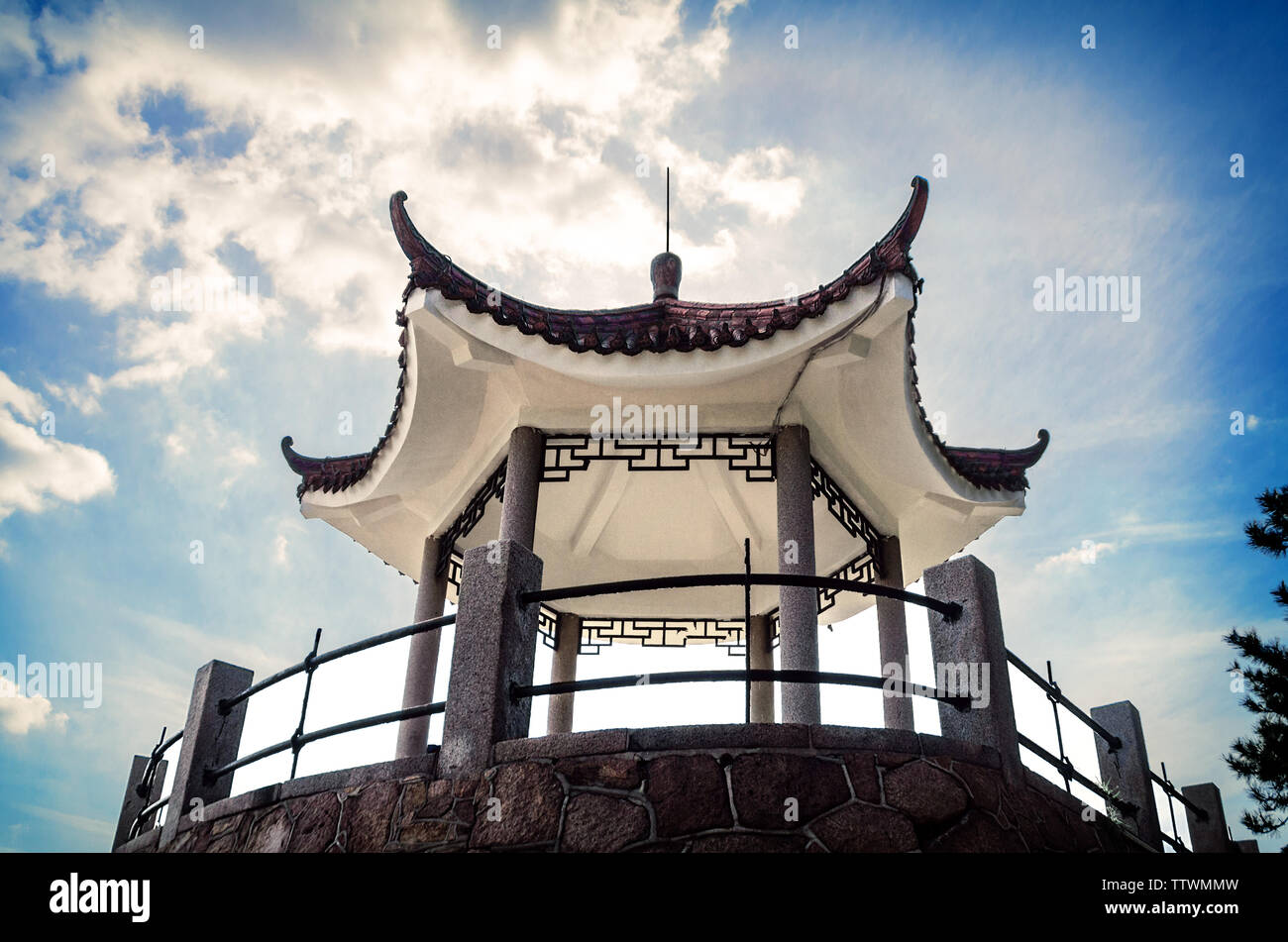 Snapping on the seaside Chinese traditional pavilion Stock Photo - Alamy
