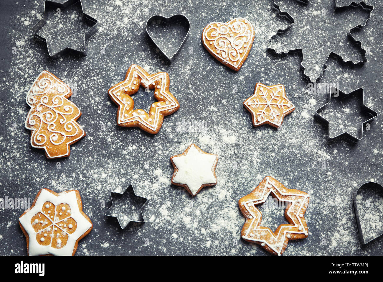 Delicious Christmas cookies with scattered powdered sugar on gray ...
