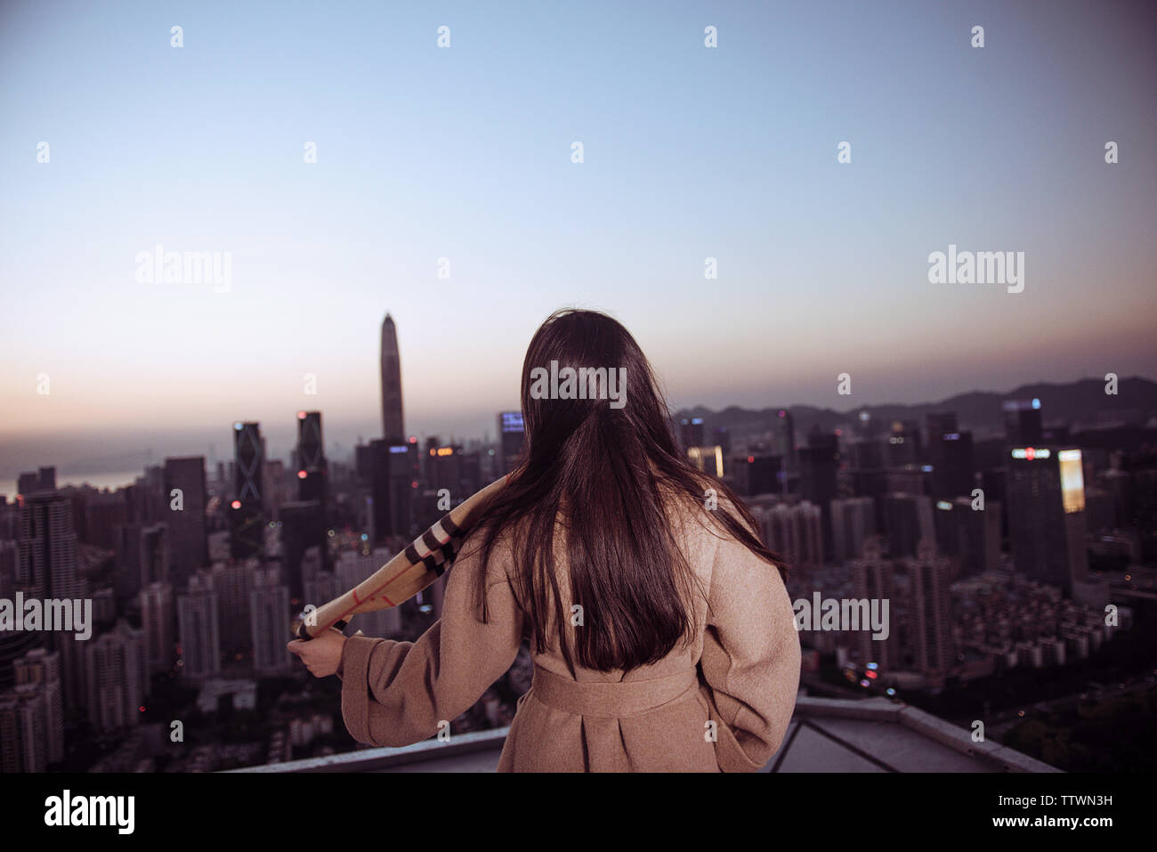 Girl on the rooftop Stock Photo - Alamy