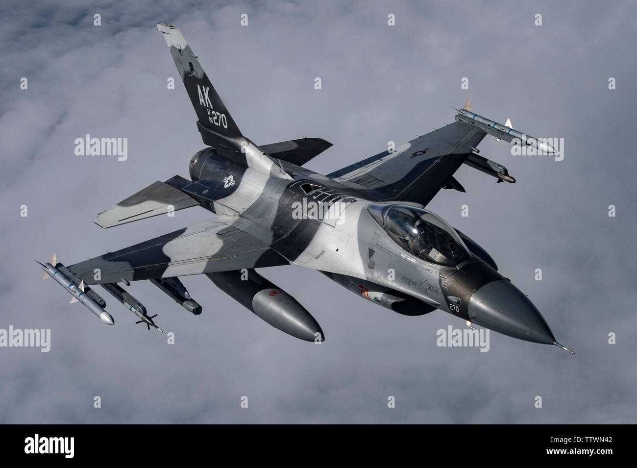 A U.S. Air Force 18th Aggressor Squadron F-16 Fighting Falcon flies ...