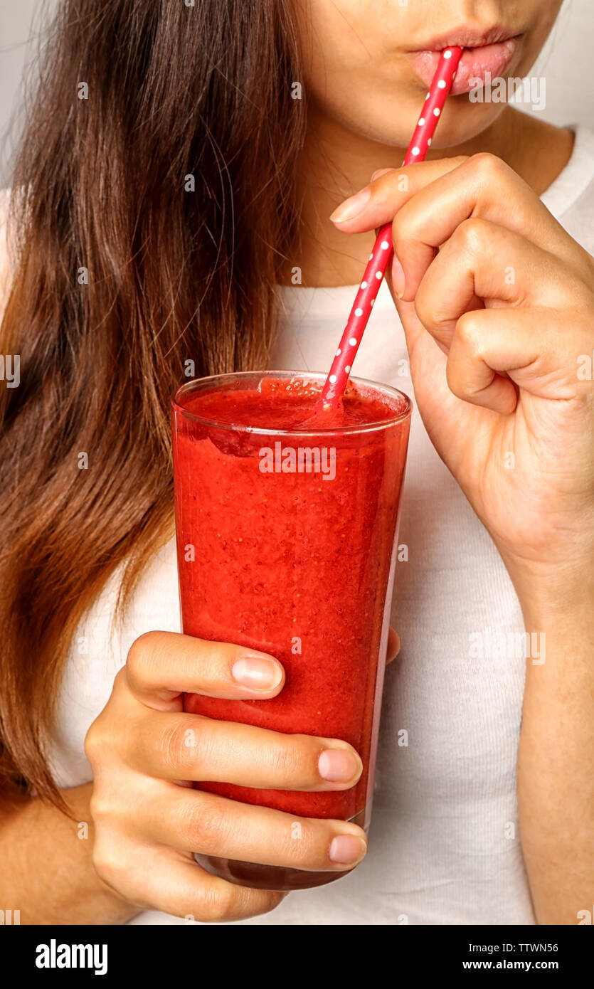 Woman drinking strawberry shake hi-res stock photography and images - Alamy