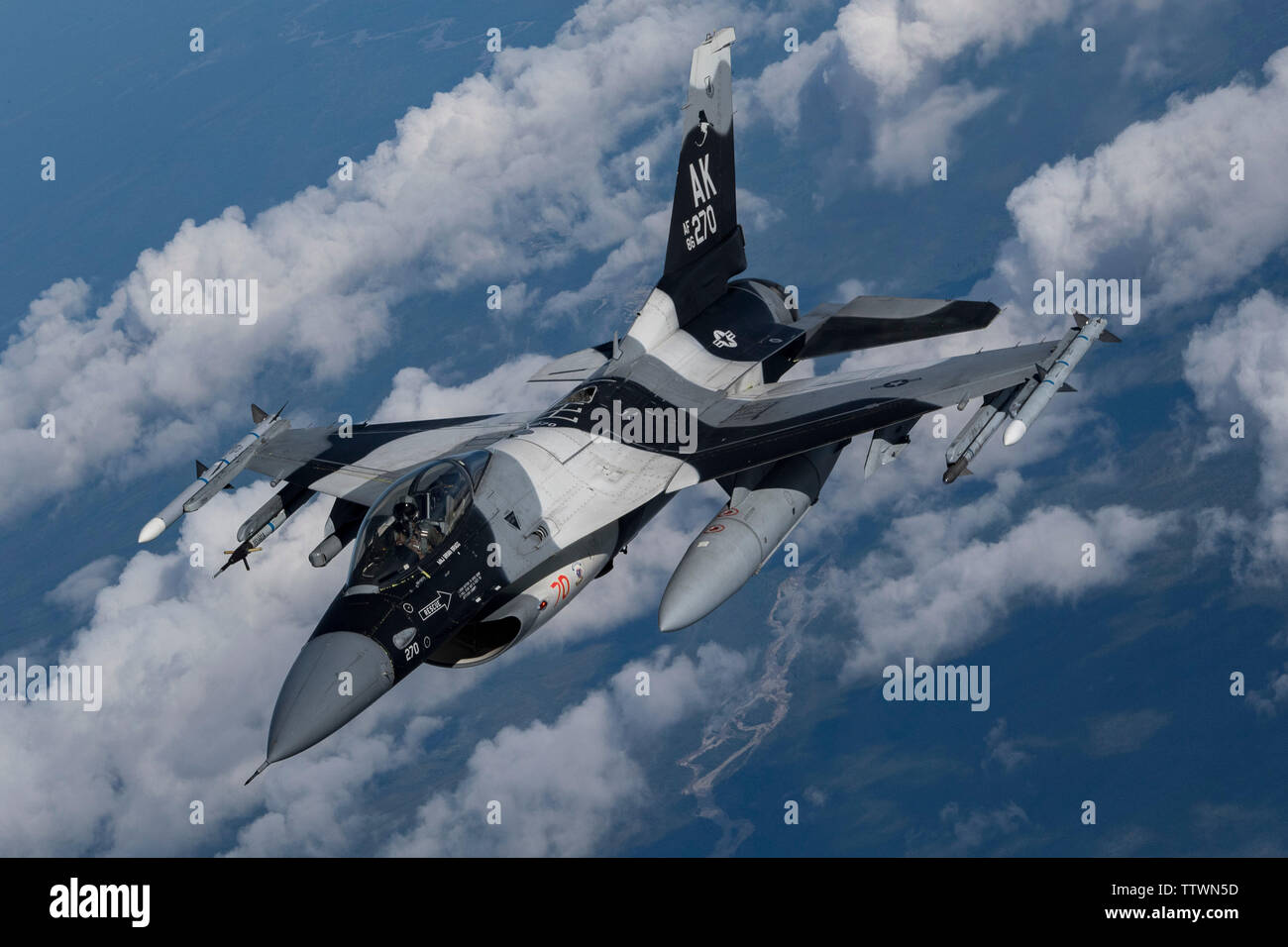 A U.S. Air Force 18th Aggressor Squadron F-16 Fighting Falcon soars ...