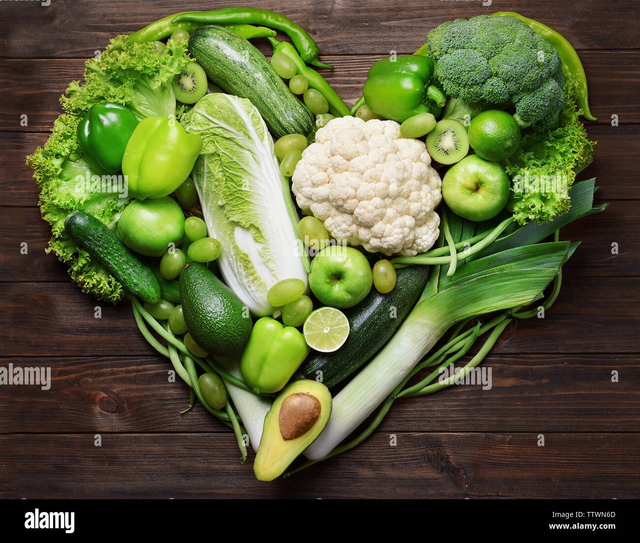 Green vegetables and fruits in shape of heart Stock Photo - Alamy