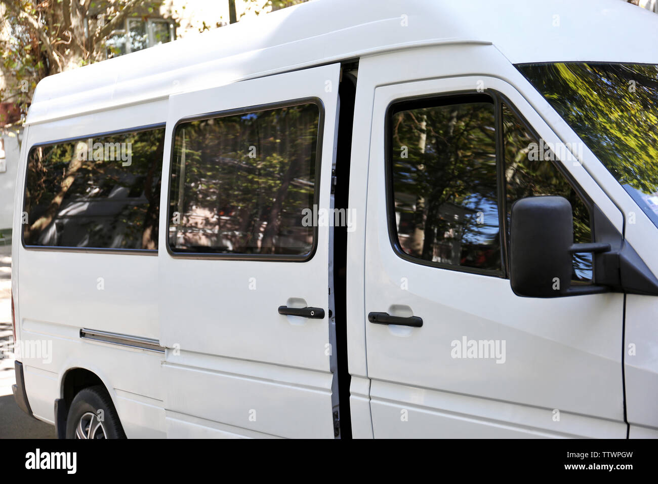 White delivery car in the yard Stock Photo - Alamy