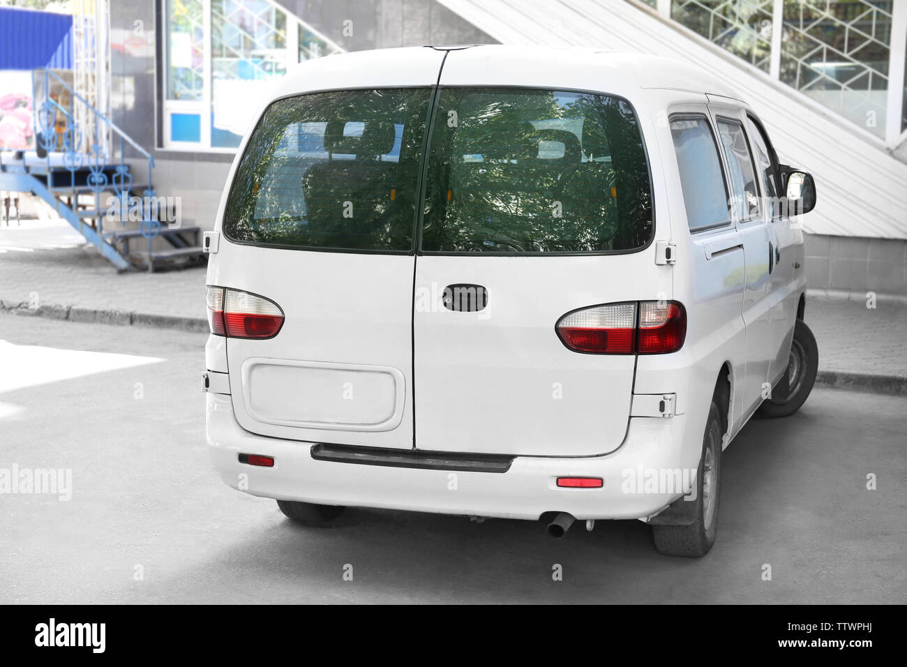White delivery car in the yard Stock Photo - Alamy