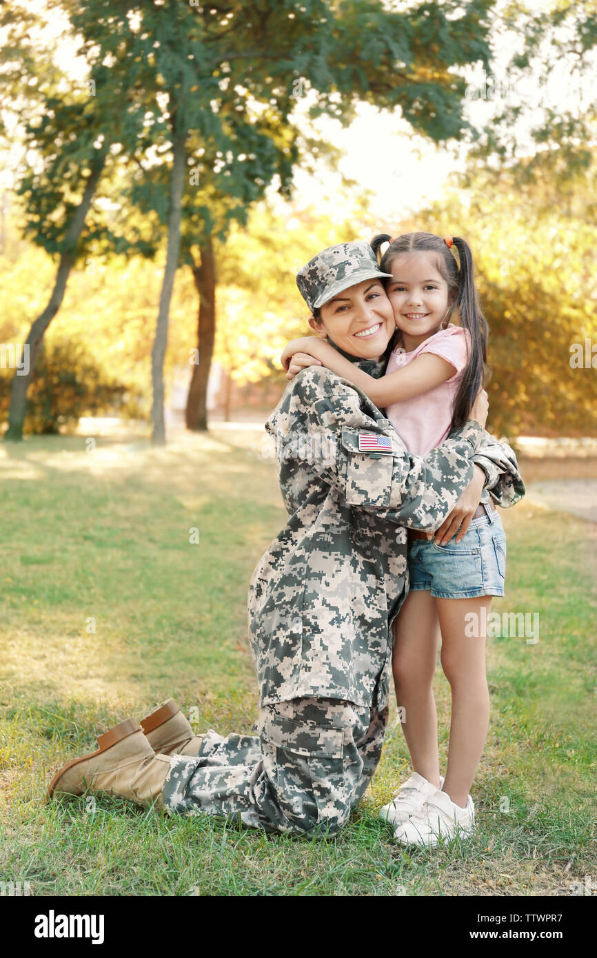 Woman in army uniform and her daughter in park Stock Photo - Alamy