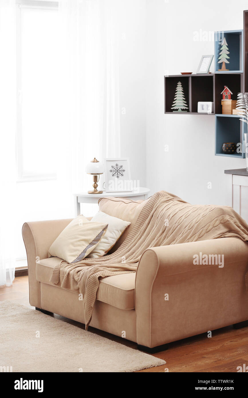 Beautiful interior with couch, shelf and window Stock Photo - Alamy