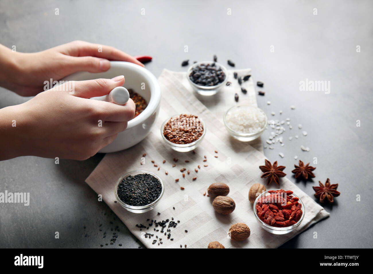 Woman grinding spices hi-res stock photography and images - Alamy