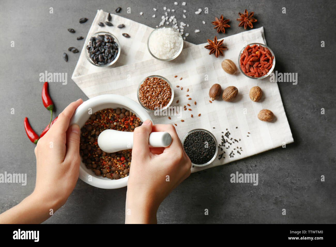 Female hands grinding spices hi-res stock photography and images - Alamy