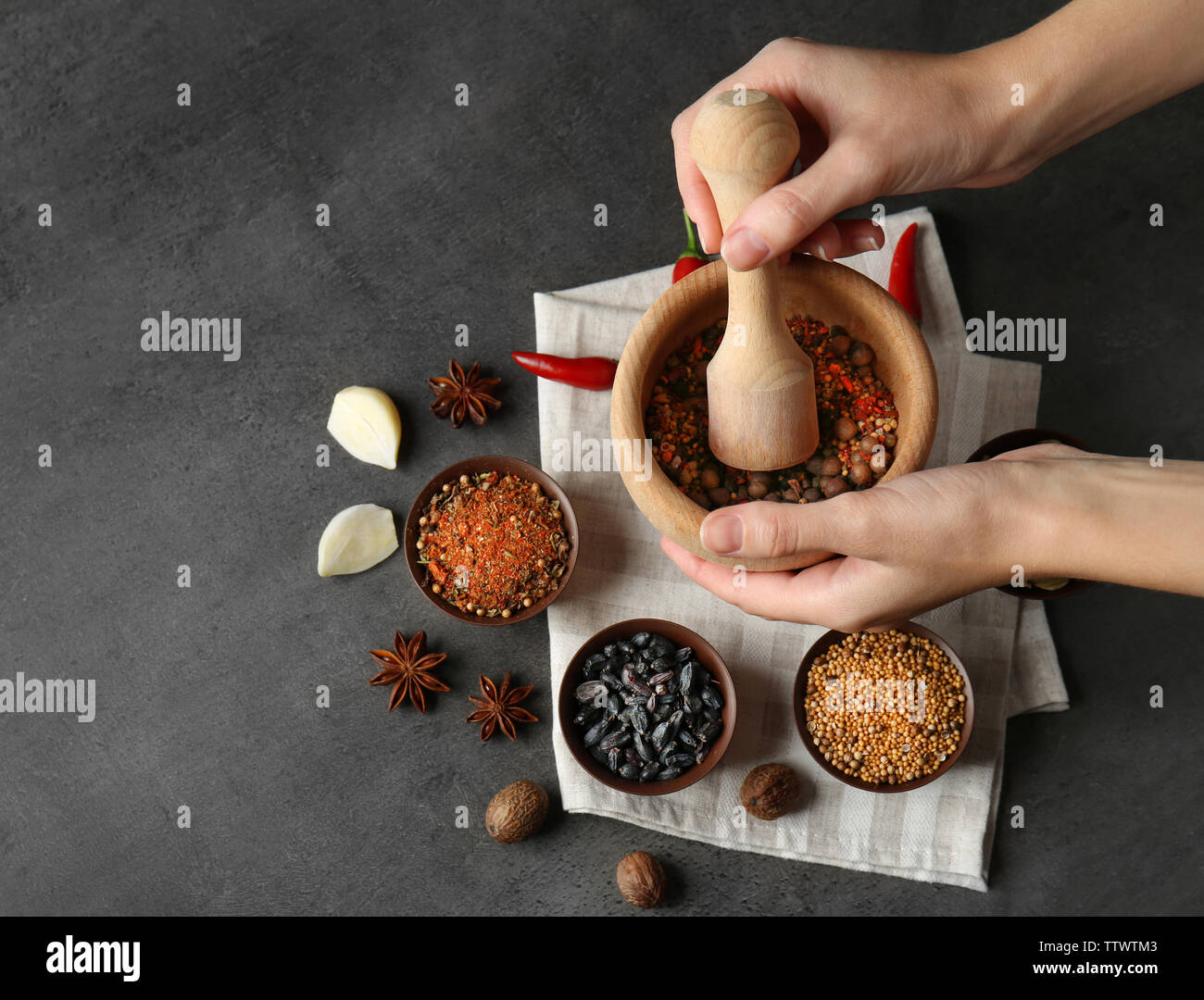 Female hands grinding spices in mortar Stock Photo - Alamy