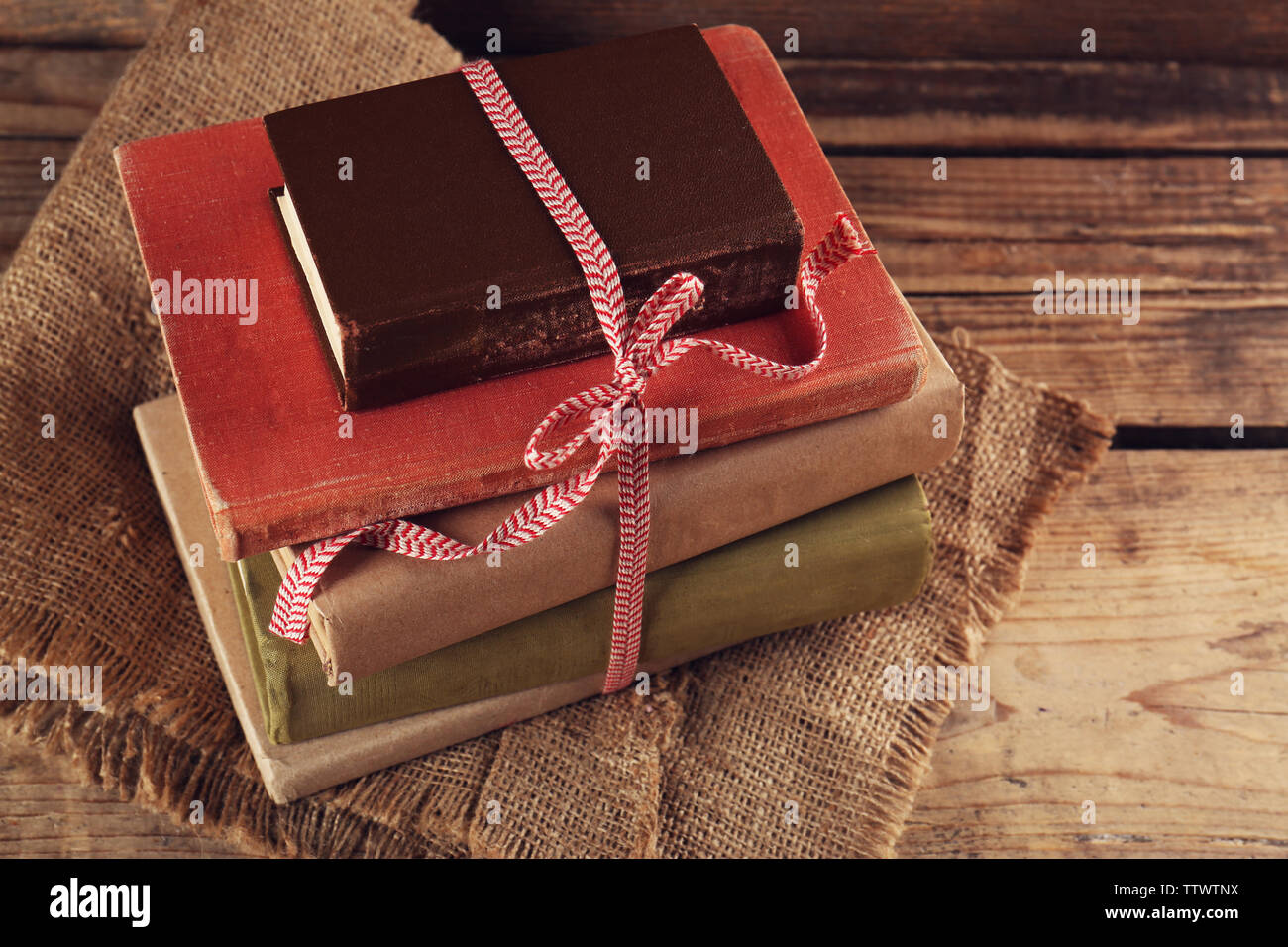 Books tied with ribbon hi-res stock photography and images - Alamy