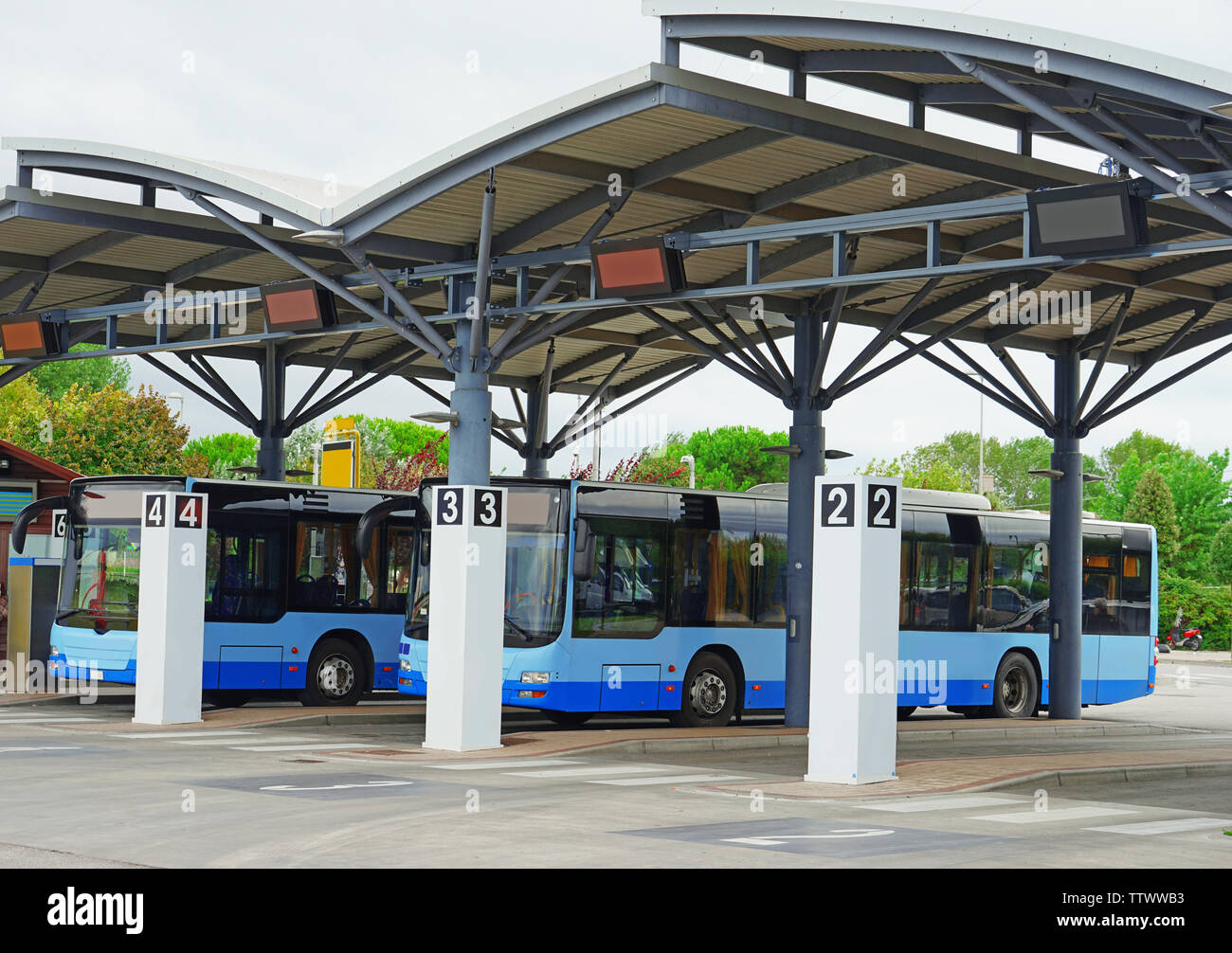 Bus station with blue buses Stock Photo - Alamy