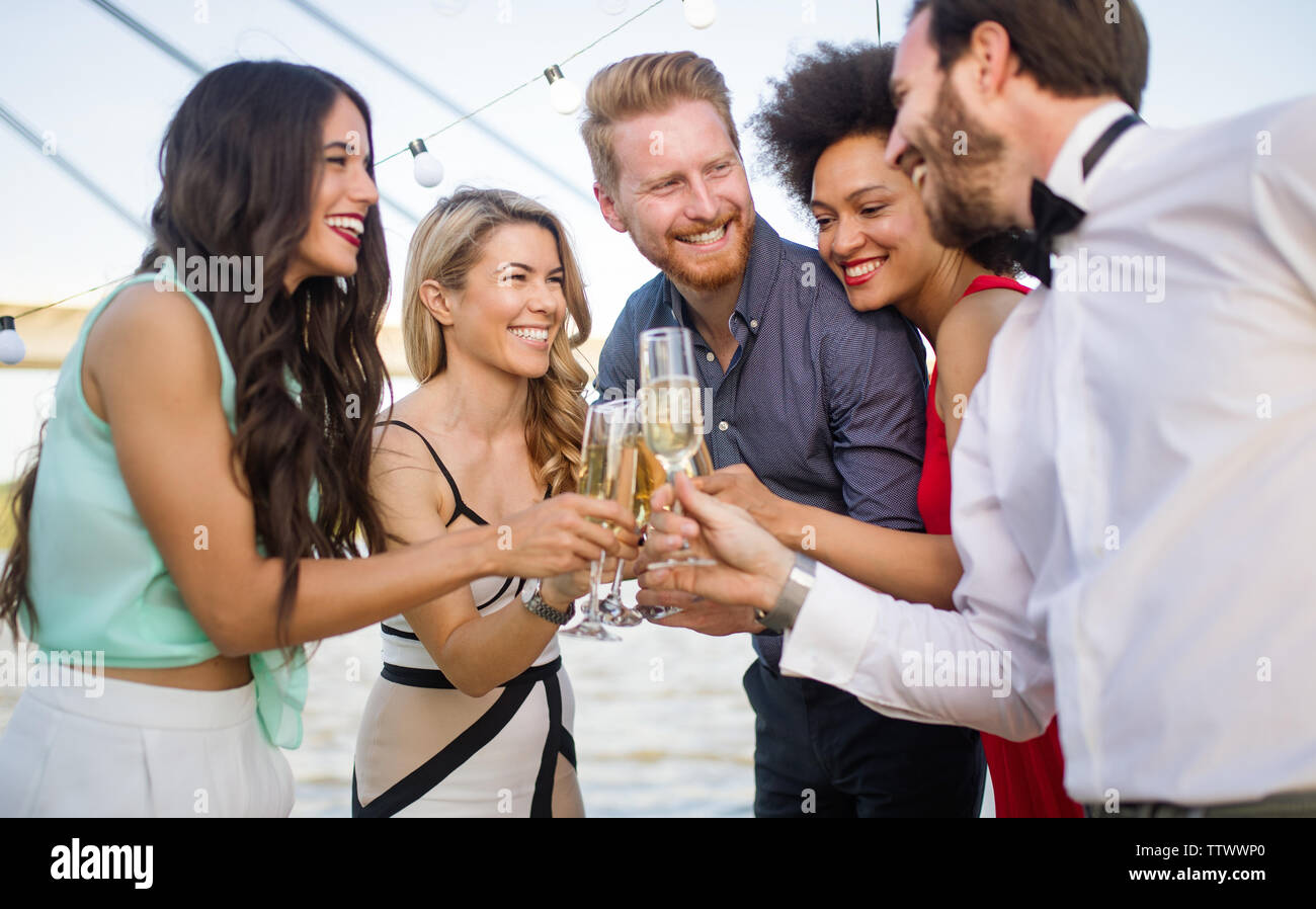Group of happy people or friends having fun at party Stock Photo - Alamy