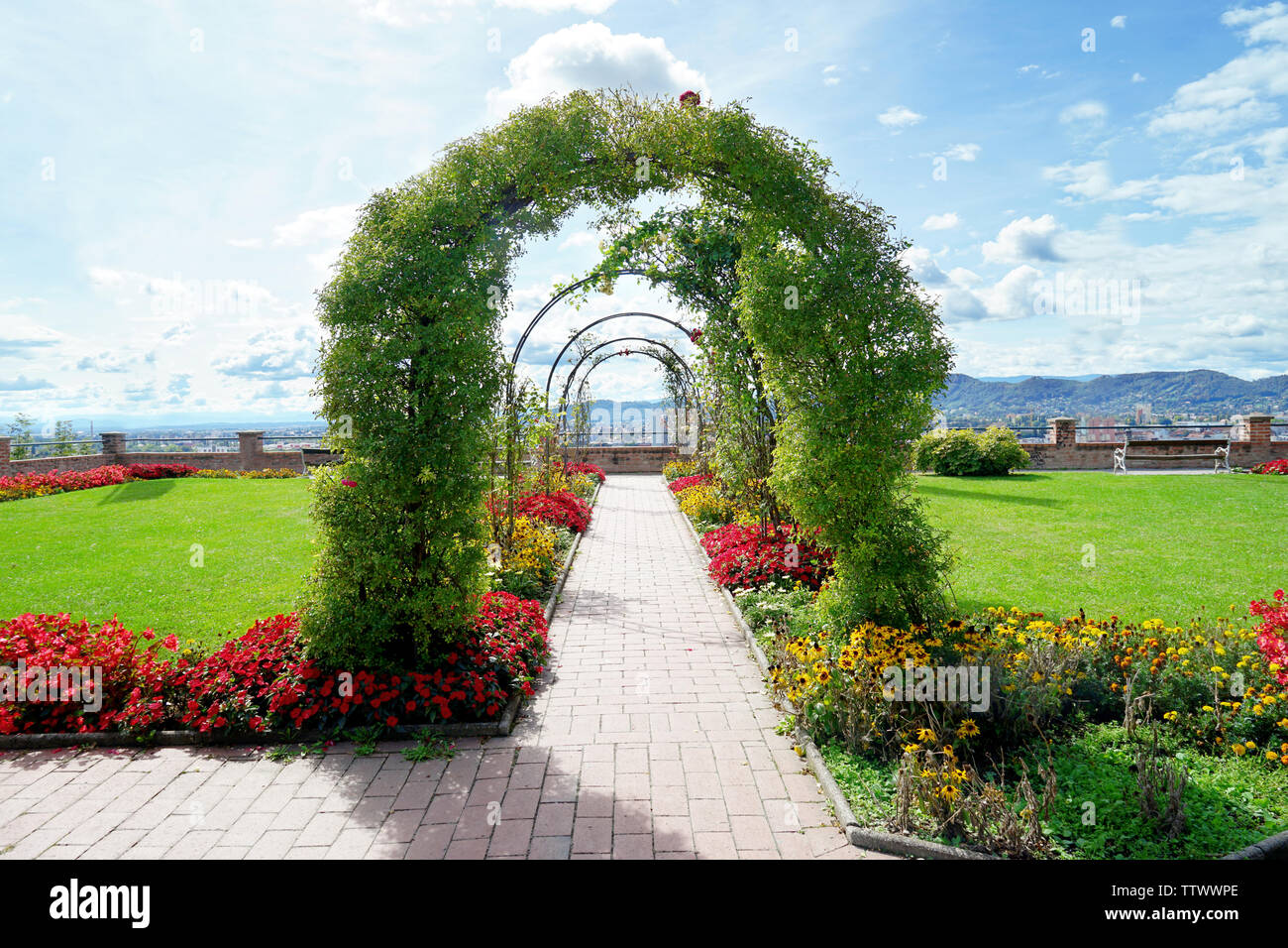 Floral arch in beautiful garden Stock Photo - Alamy