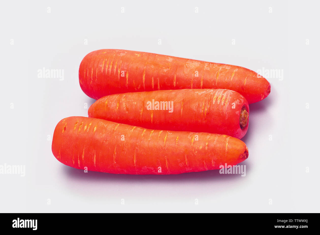 Three carrots hi-res stock photography and images - Alamy
