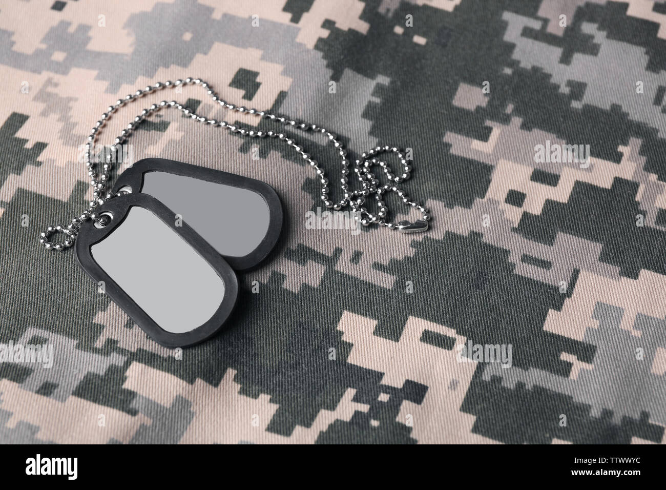 Military ID tag on uniform background Stock Photo - Alamy