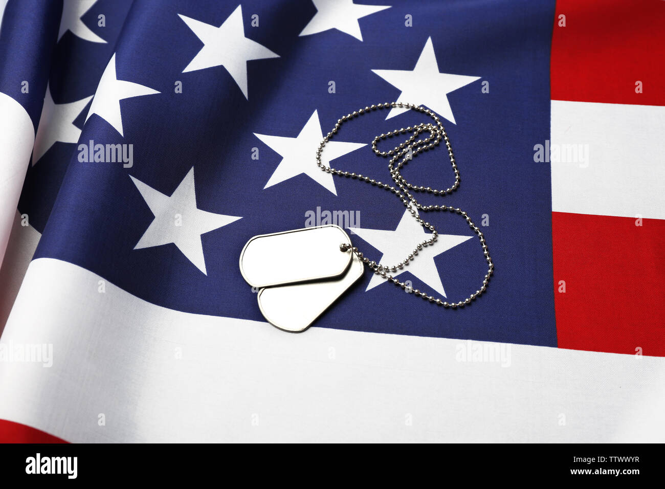Military ID tags on USA flag background Stock Photo - Alamy