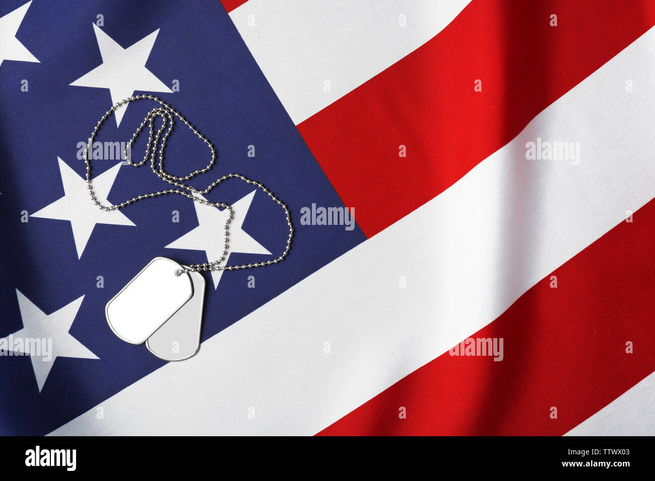 Military ID tags on USA flag background Stock Photo - Alamy