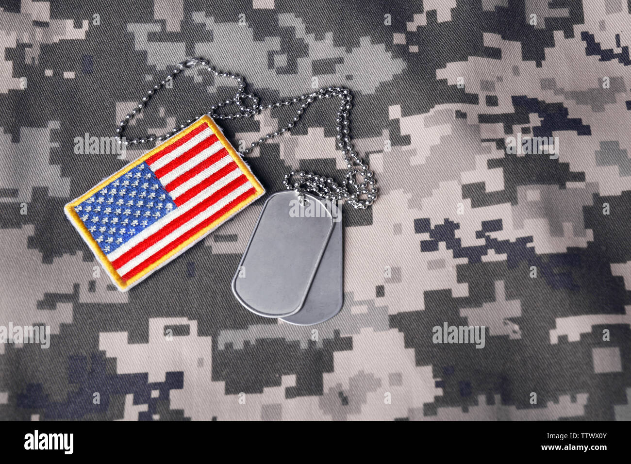 Military ID tags with USA flag on uniform background Stock Photo - Alamy
