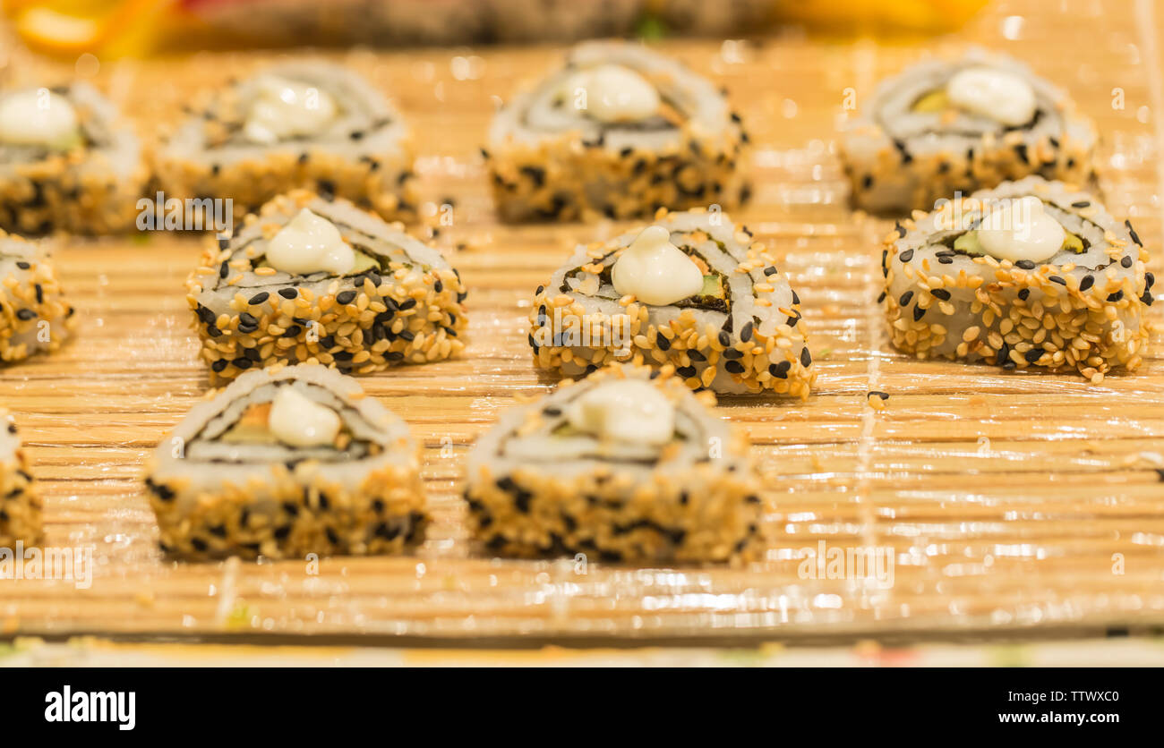 delicious triangle shape sushi display on the tray Stock Photo - Alamy