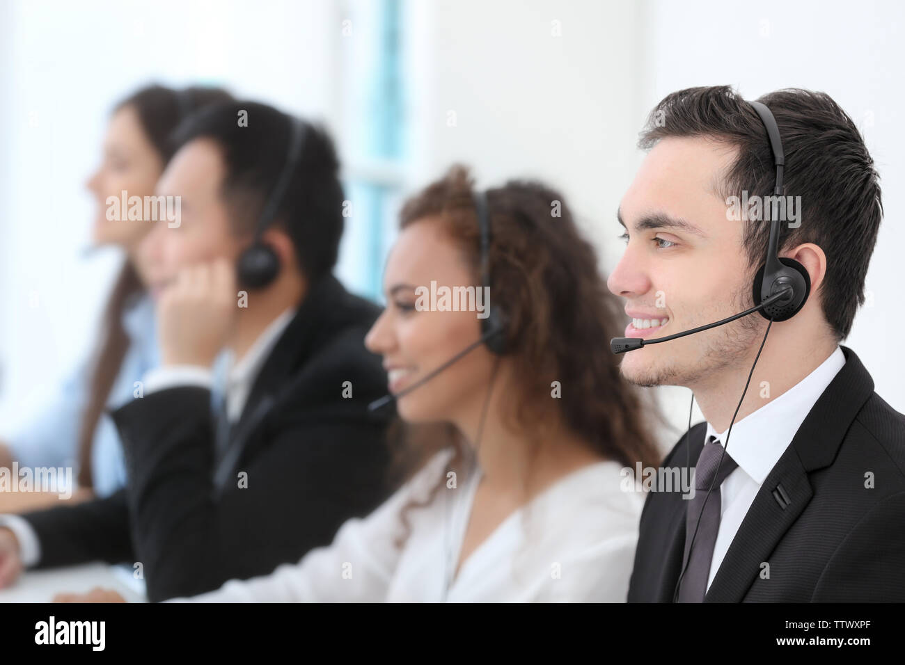 Call center operators at work Stock Photo - Alamy