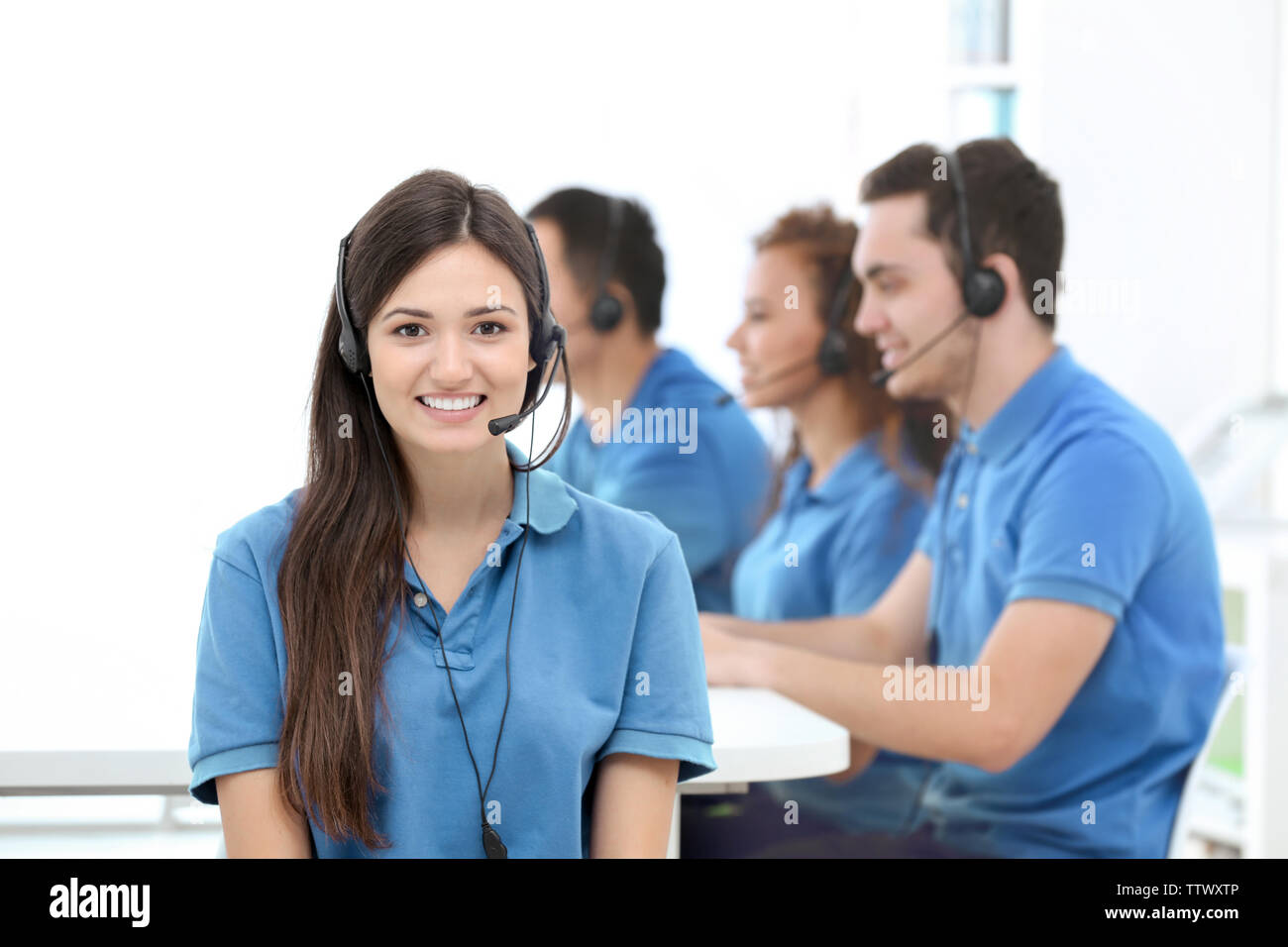 Female call center operator working in office Stock Photo - Alamy