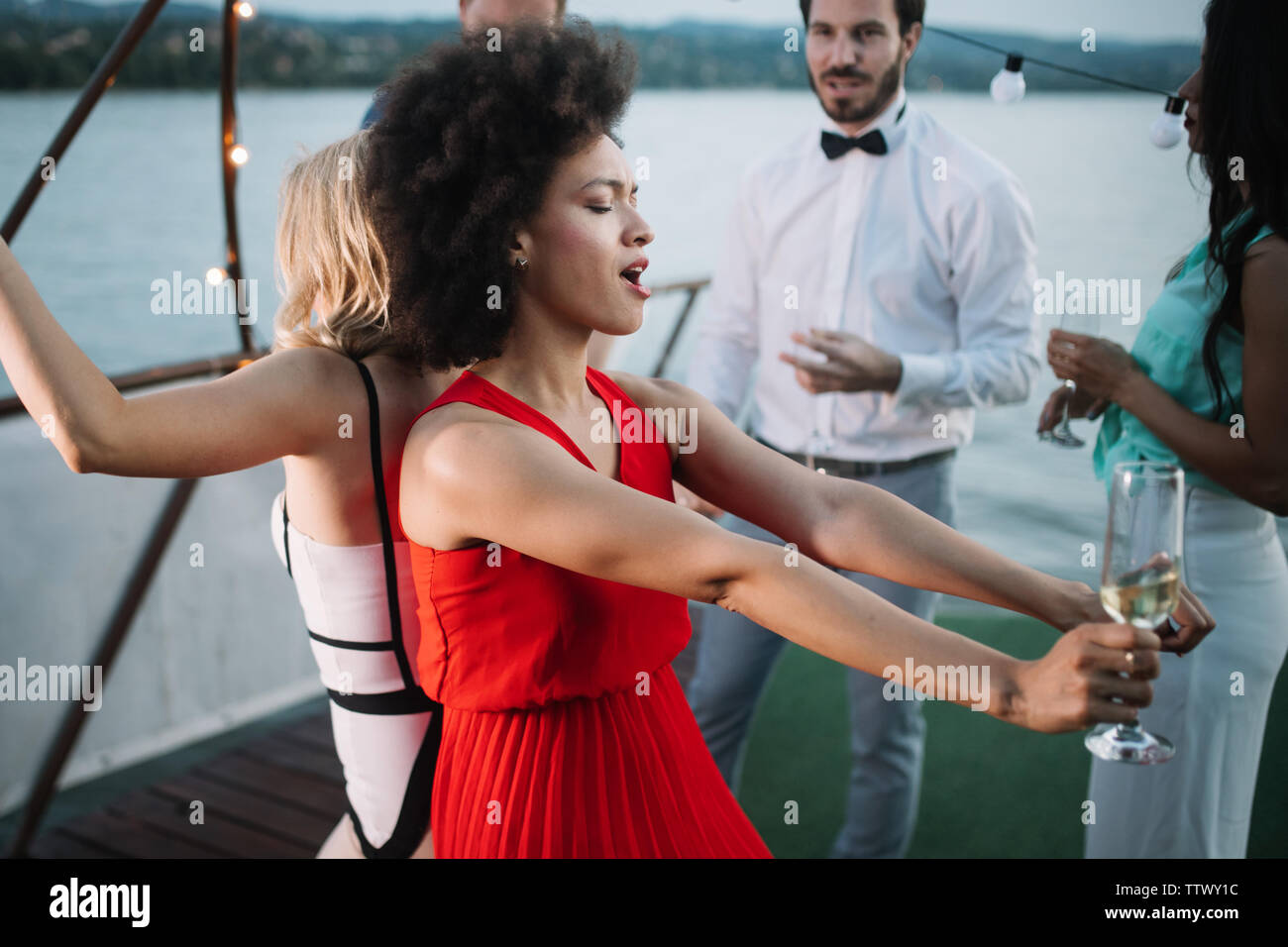 Group of happy people or friends having fun at party Stock Photo - Alamy