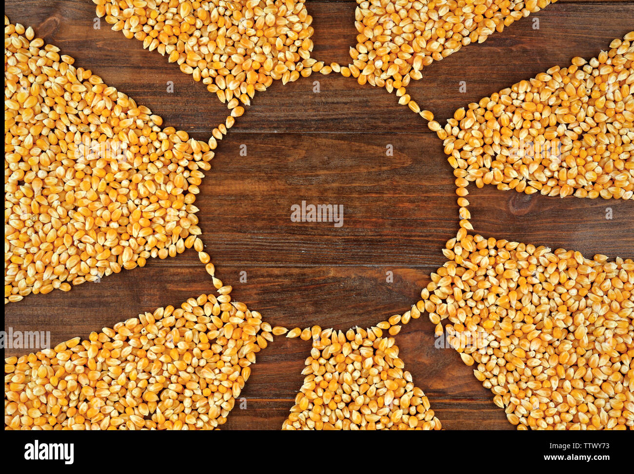 Corn grains in sun shape Stock Photo - Alamy