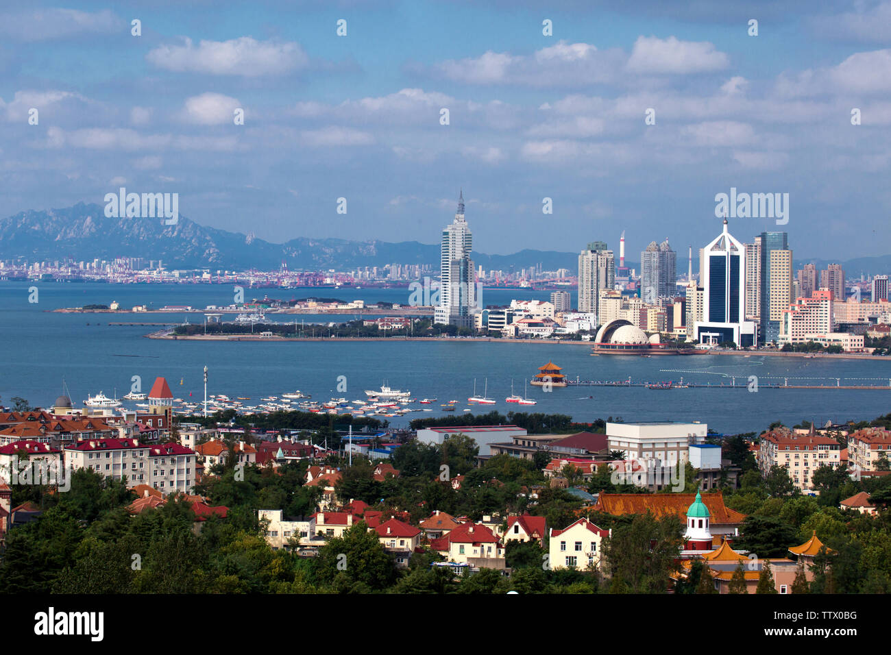 Qingdao red tile green trees blue sea blue sky hi-res stock photography ...