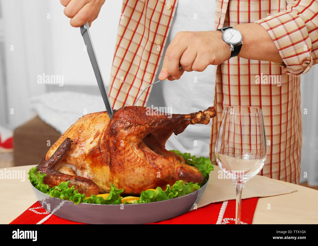 Man carving tasty Thanksgiving turkey, close up view Stock Photo - Alamy