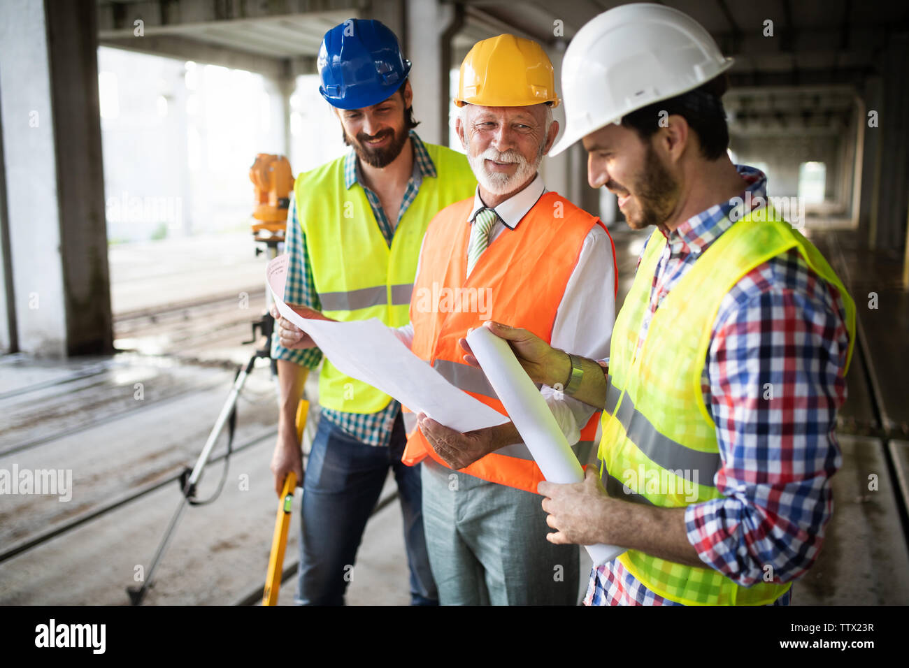 Group of construction engineer working in construction site Stock Photo ...