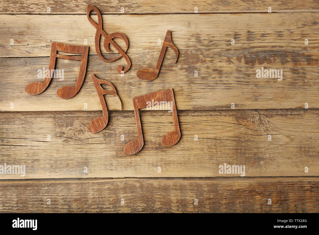 Music notes on wooden background Stock Photo - Alamy