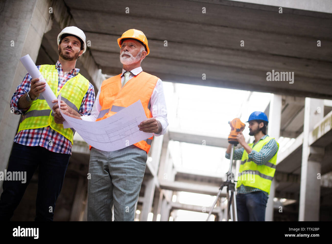 Group of construction engineer working in construction site Stock Photo ...