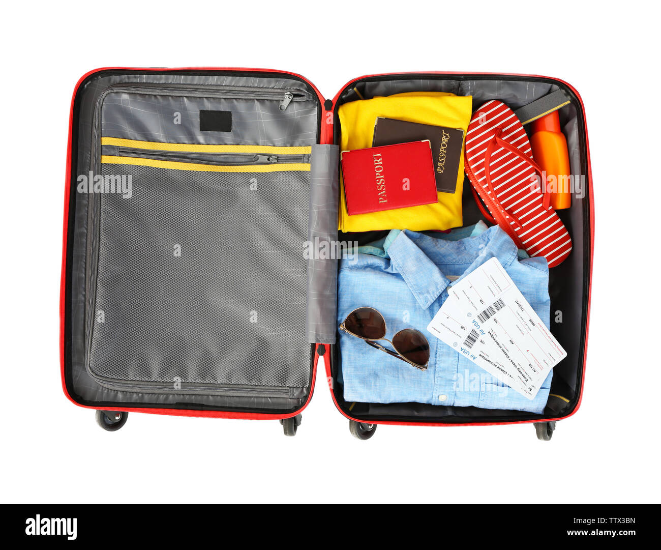 Open suitcase with traveller set on white background Stock Photo - Alamy