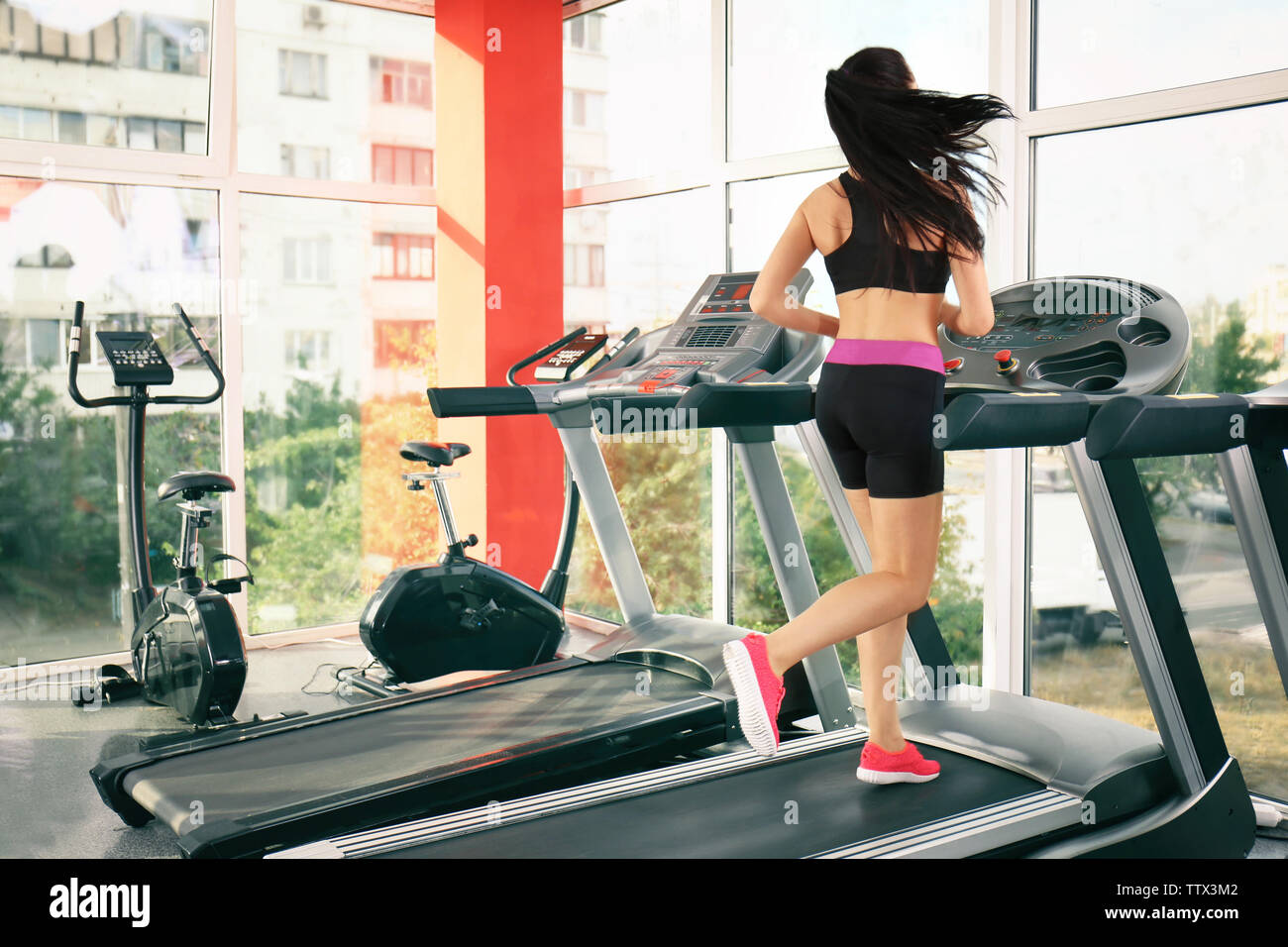 Woman running on treadmill slow hi-res stock photography and images - Alamy