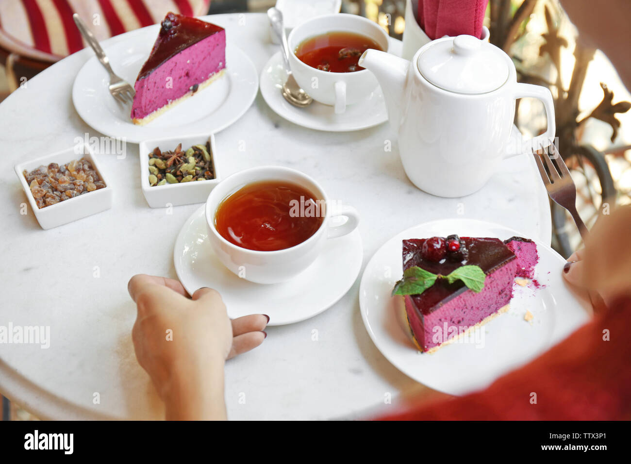 Woman drinking tea in modern cafe Stock Photo - Alamy